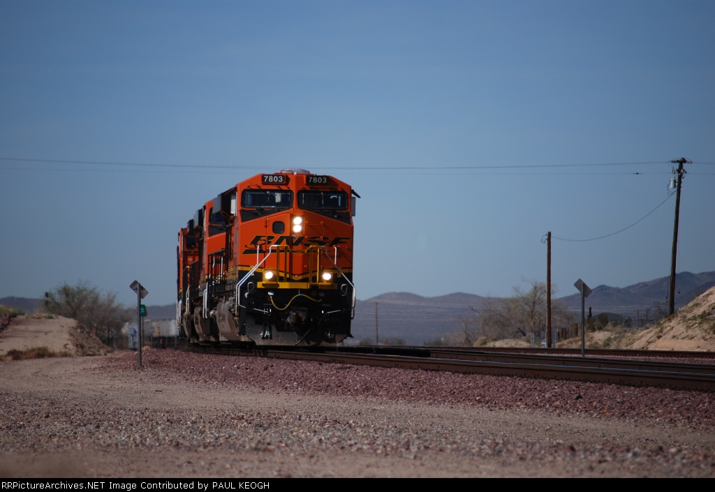 BNSF 7803 starts to make the curve as she slows down to enter BNSF Barstow leading seven otfer ...
